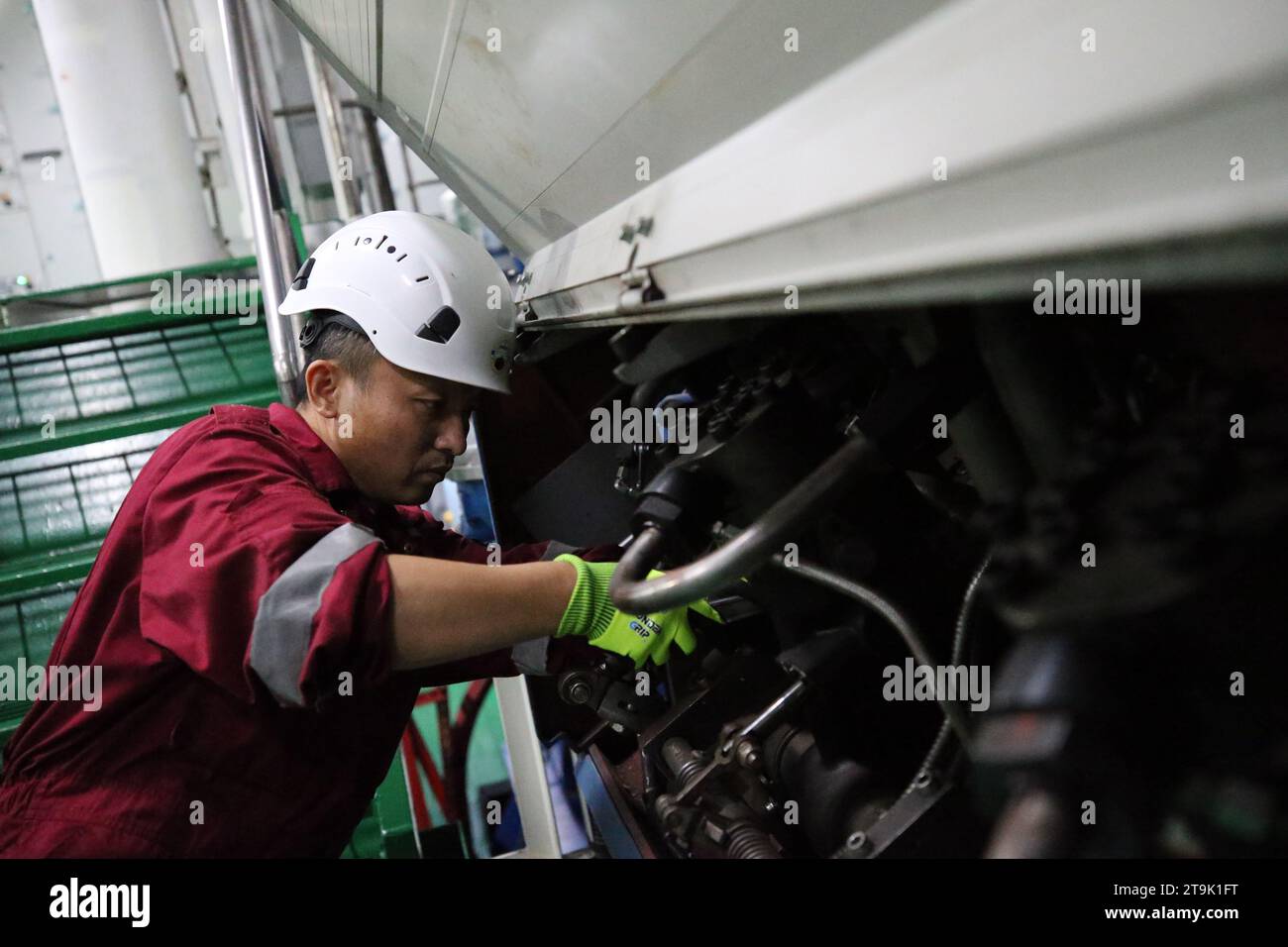 Aboard Xuelong 2. 26th Nov, 2023. Chief Machinist Tang Jianguo checks ...