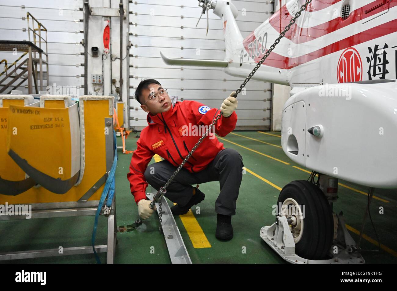Aboard Xuelong 2. 26th Nov, 2023. Wang Fa, a machinist, checks and ...