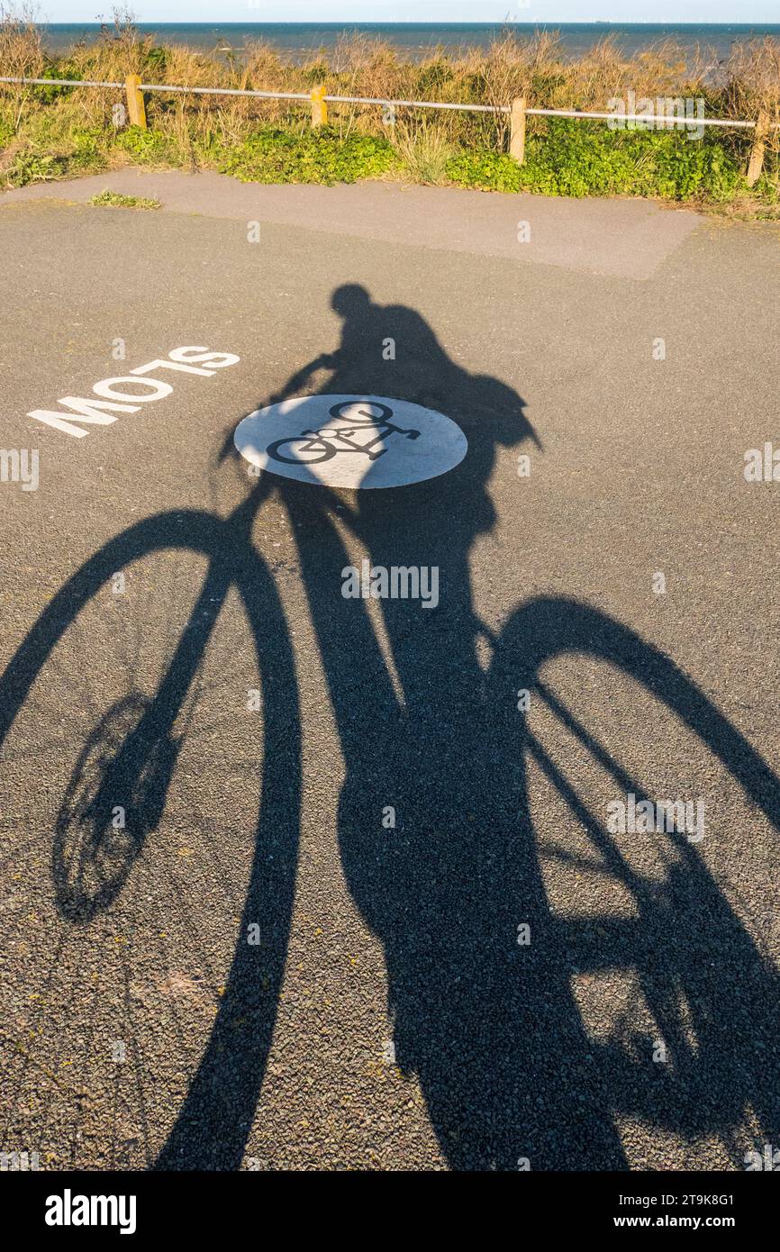 Shadow of a cyclist on a coastal cycle path in Margate Kent UK Stock ...