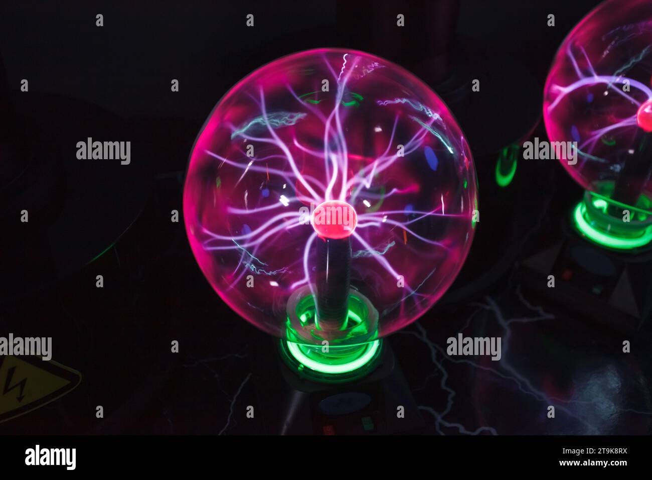 Glass ball with plasma Tesla lightning bolts Stock Photo - Alamy