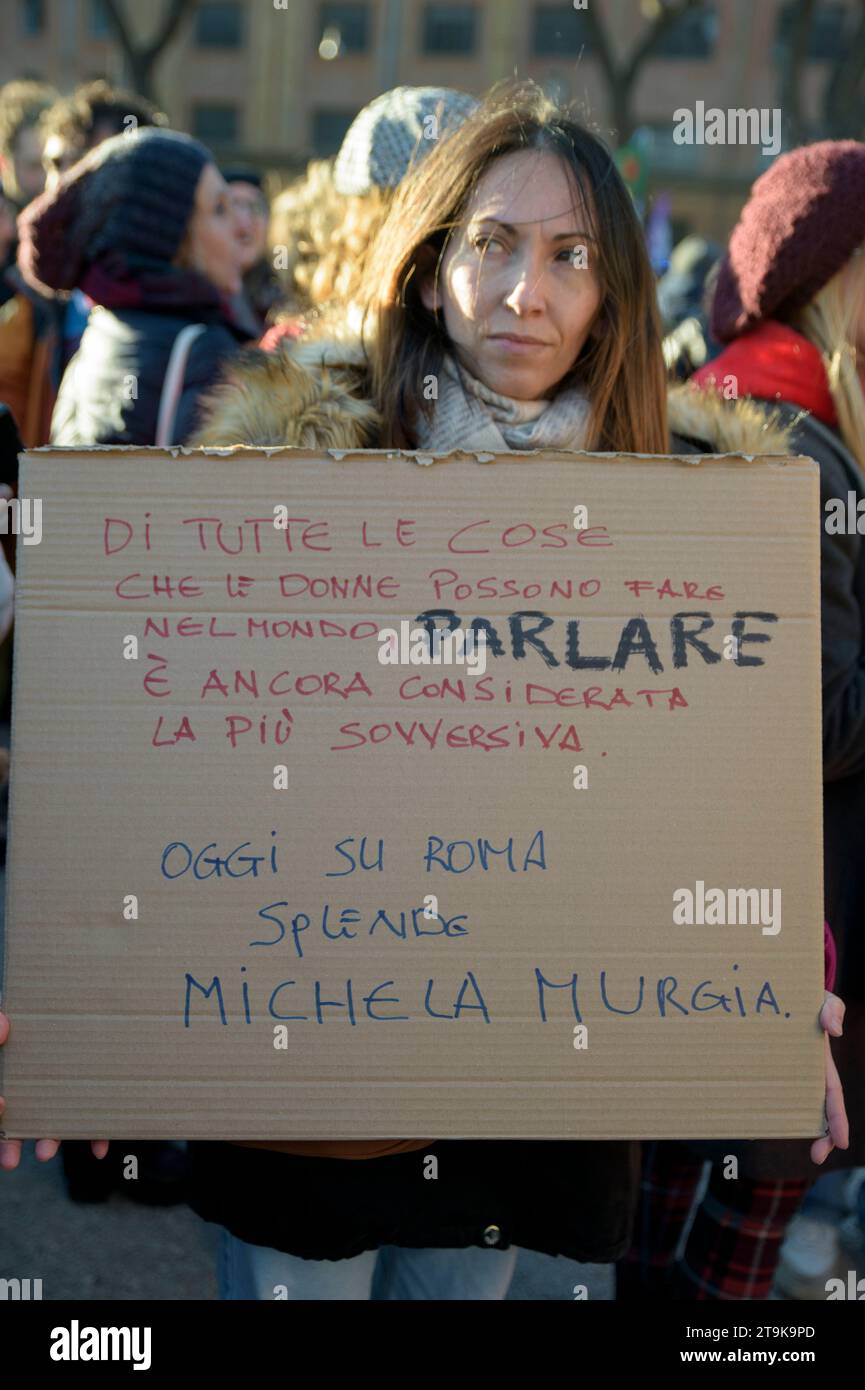 Rome, Italy. 25th Nov, 2023. A woman holds up a sign that invites women ...