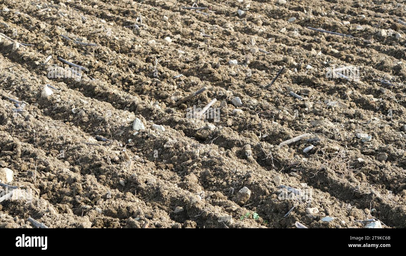 Close up ploughed land soil with tractor wheel trail Stock Photo - Alamy