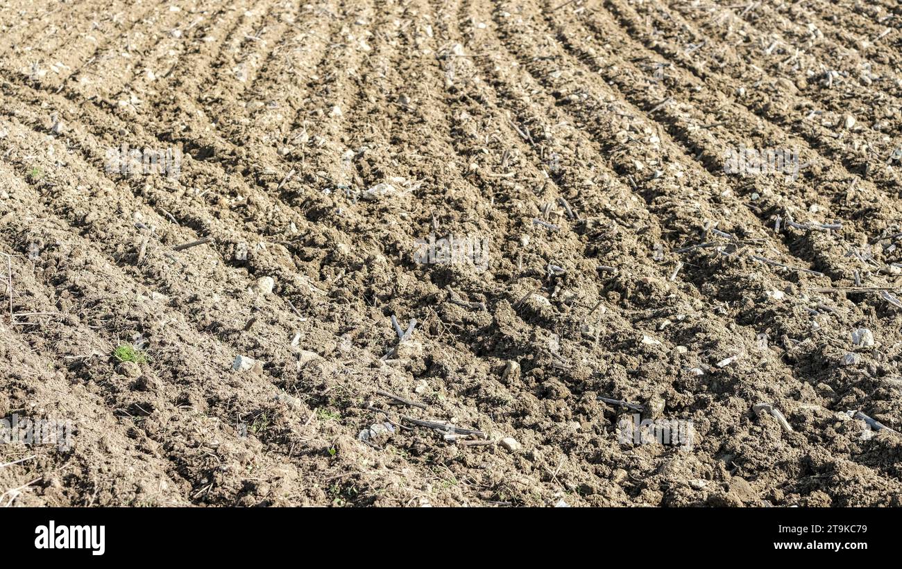 Close up ploughed land soil with tractor wheel trail Stock Photo - Alamy