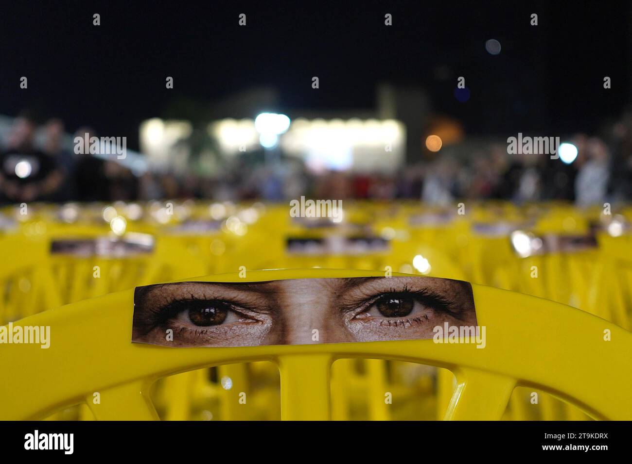 Images of people's eyes adorn empty yellow chairs, representing ...