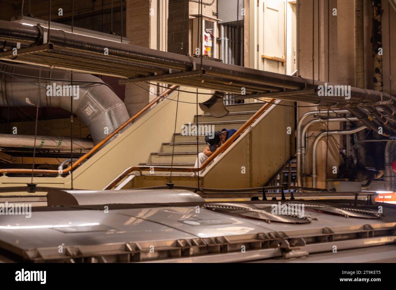 sleeping man in basement in grand central terminal, new york city, usa ...