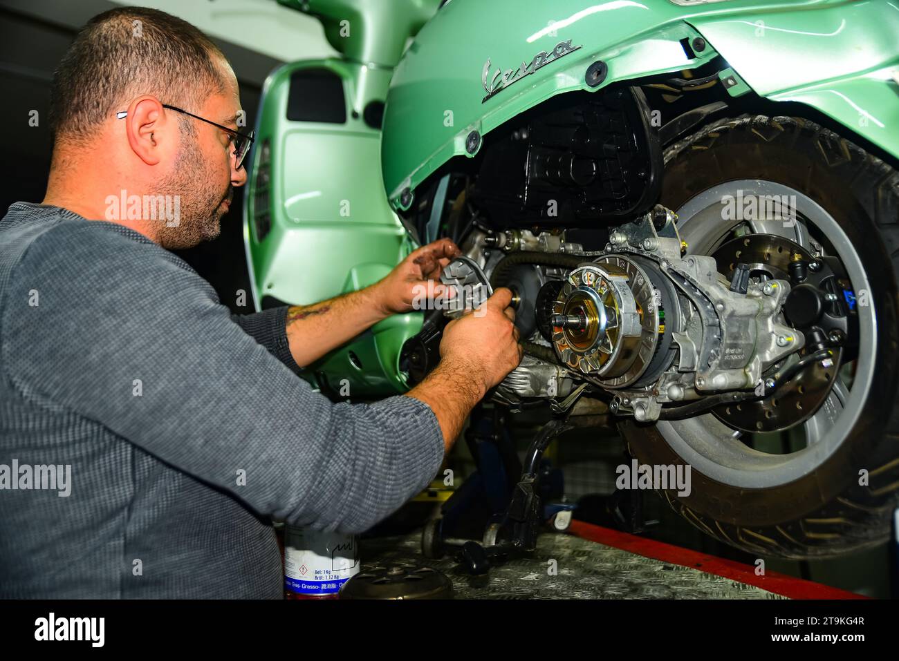 Italian scooter Variator repair, Motorcycle mechanic repairman Stock ...