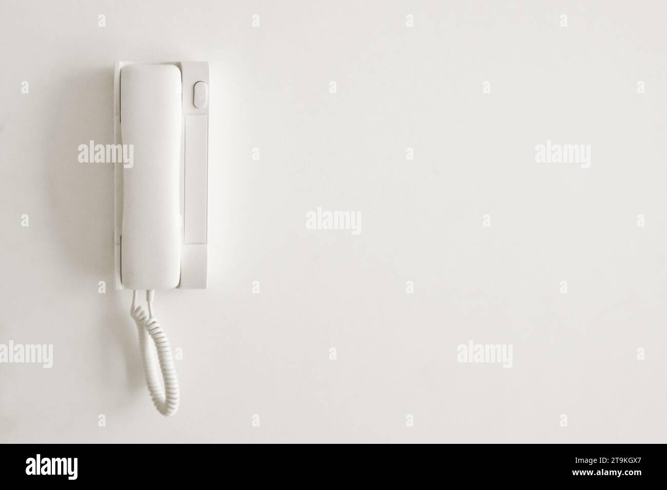 White coiled phone cord hi-res stock photography and images - Alamy