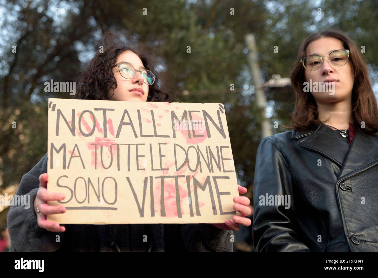 Rome, Italy. 25th Nov, 2023. A girl next to her friend shows a sign ...
