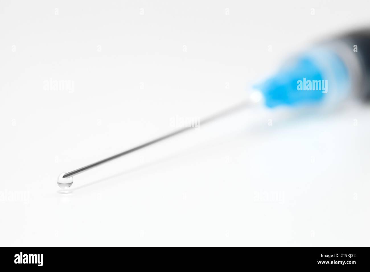 Needle сlose-up on syringe and drop of liquid medicine at end Stock ...