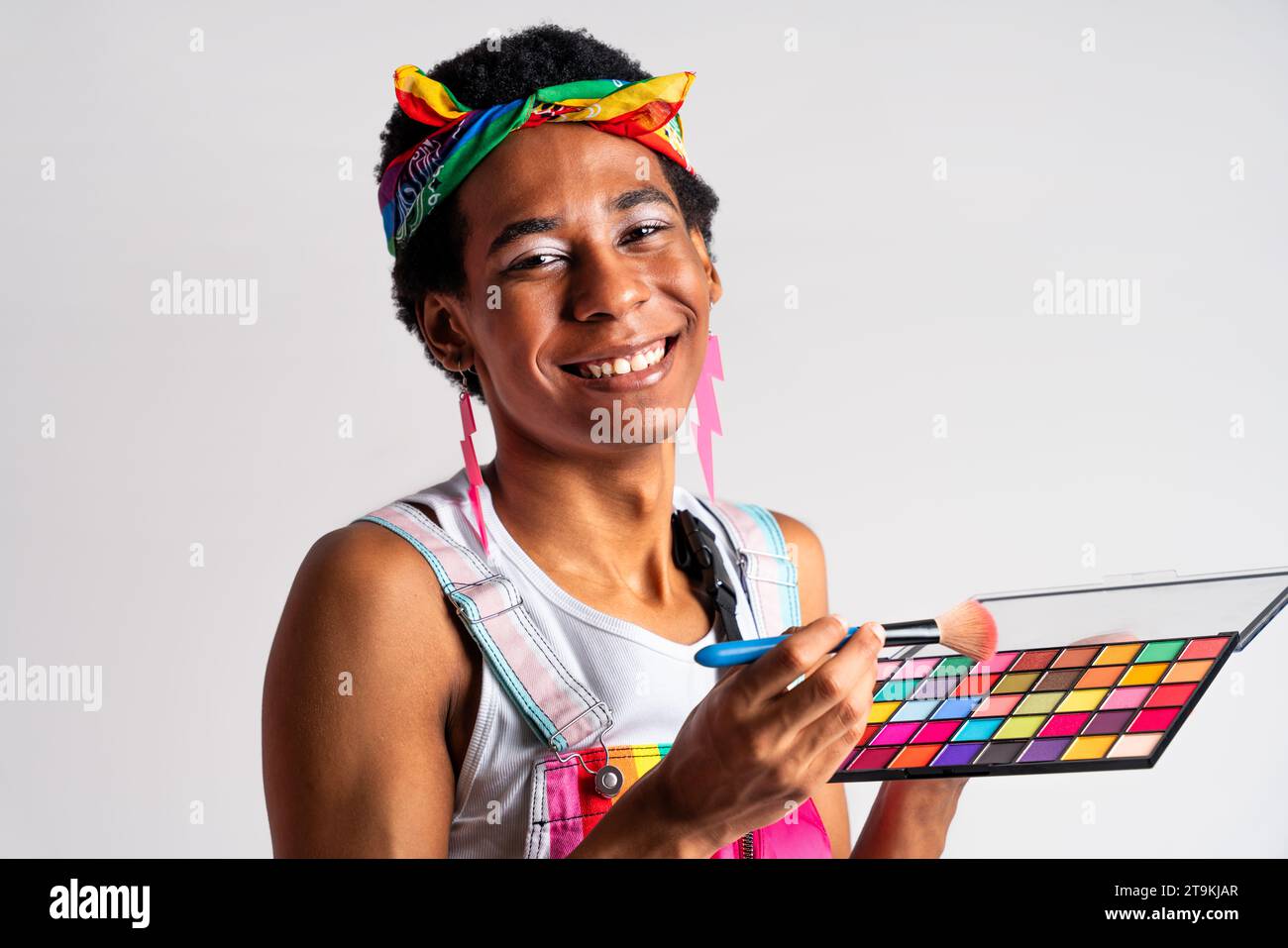 Fluid gender hispanic latin black man posing in studio with fashionable ...