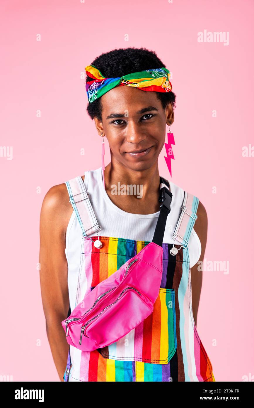 Fluid gender hispanic latin black man posing in studio with fashionable ...