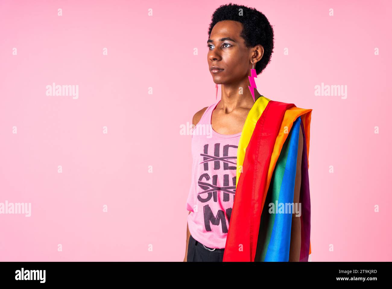 Fluid gender hispanic latin black man posing in studio with fashionable ...