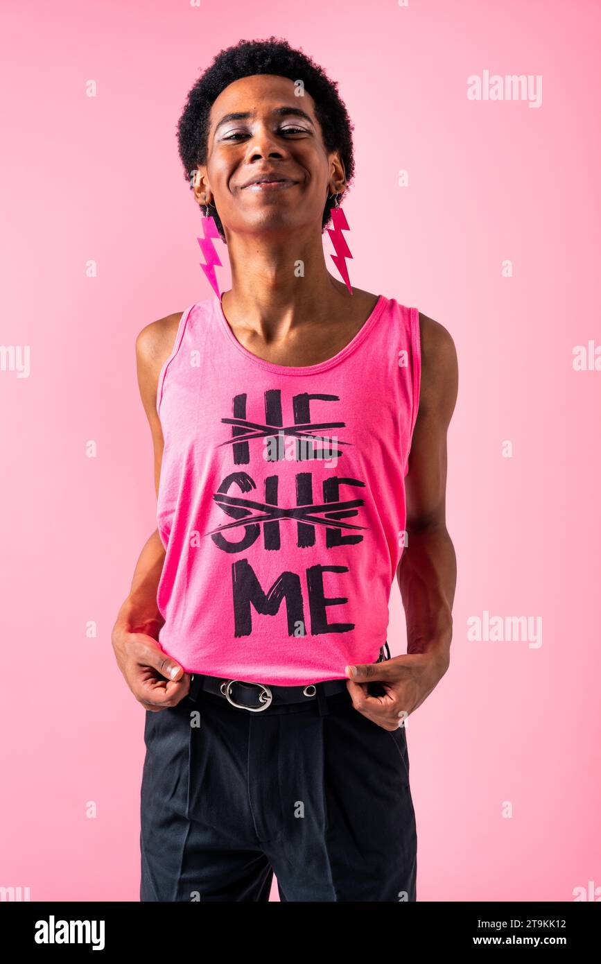 Fluid gender hispanic latin black man posing in studio with fashionable ...