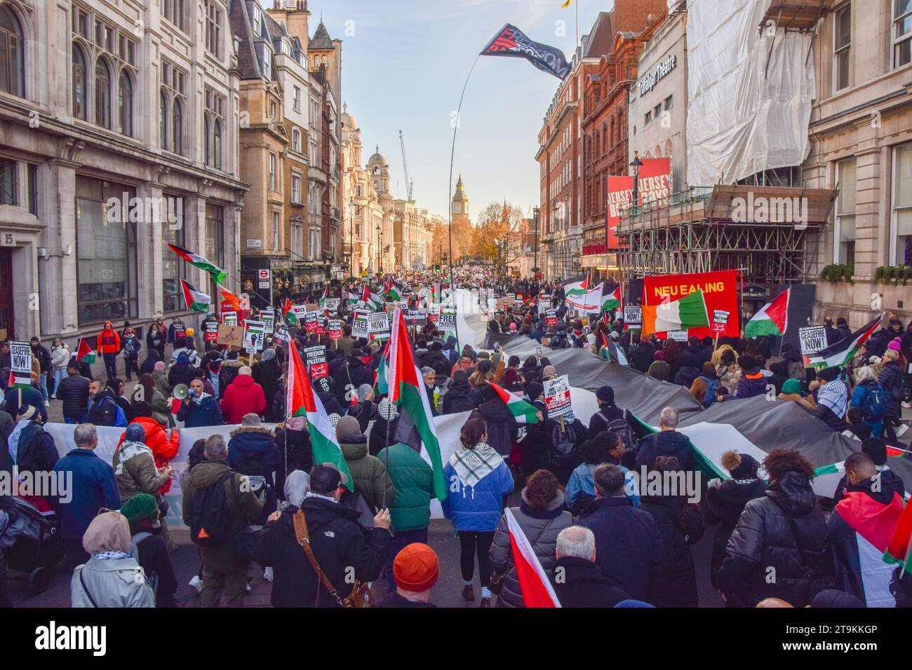 London, UK. 25th November 2023. Protesters hold a giant Palestinian ...