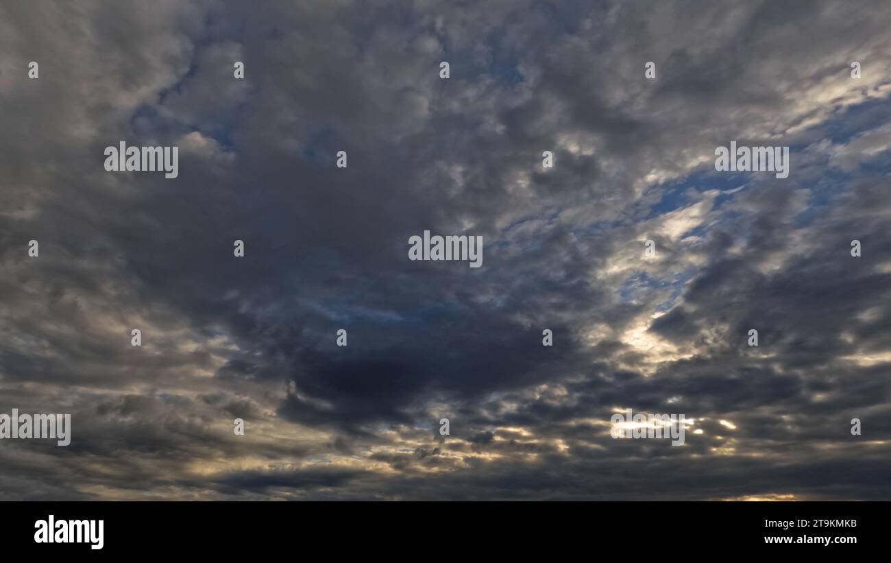 pretty skyscape of sky with massive rain or snow clouds backdrop ...