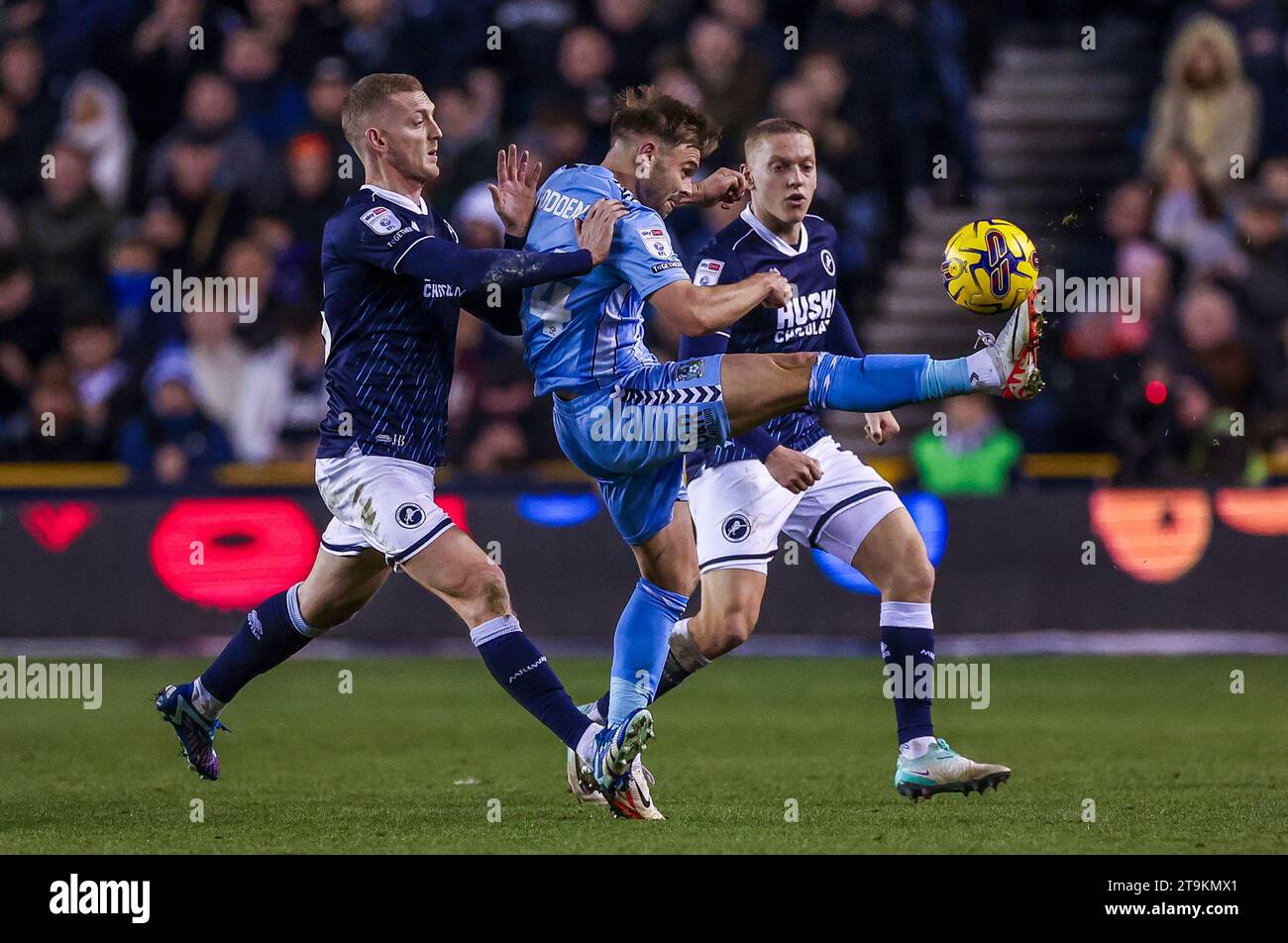 Coventry City's Matthew Godden in action with Millwall's George Saville ...