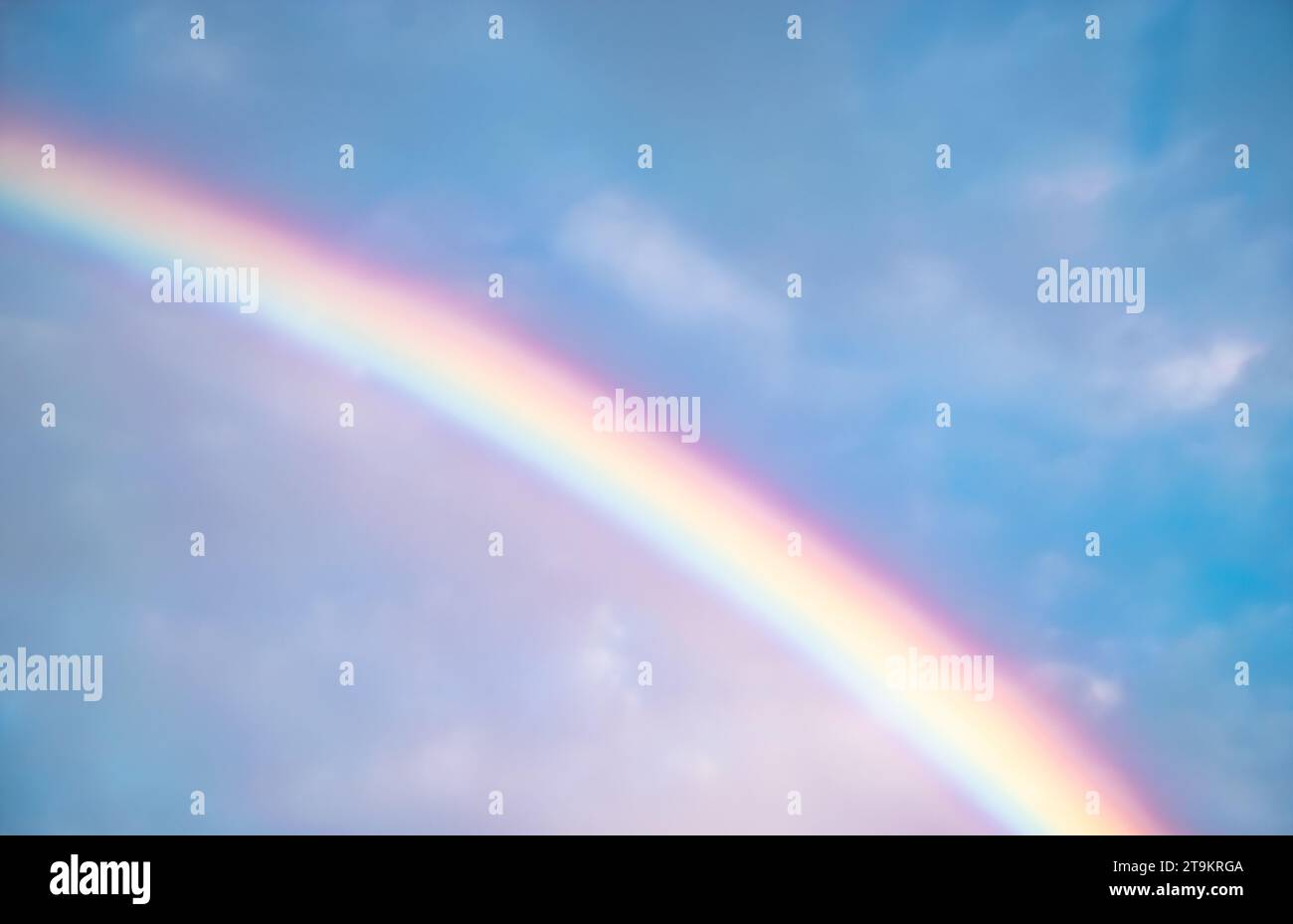Beautiful rainbow in sky exposing full range of colors as diversity and ...