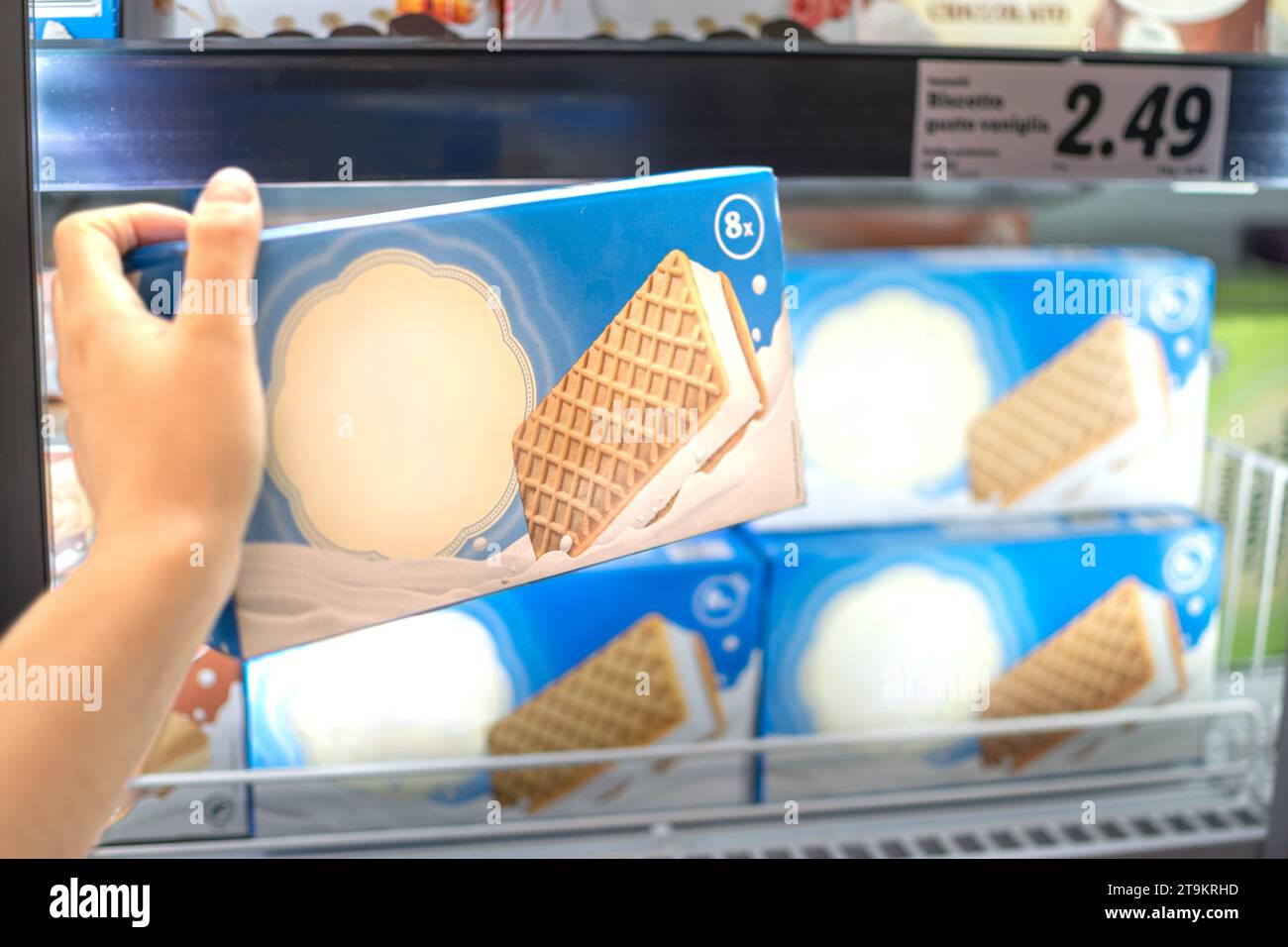 Hand taking Ice Cream stocked on supermarket for selling and ready for ...