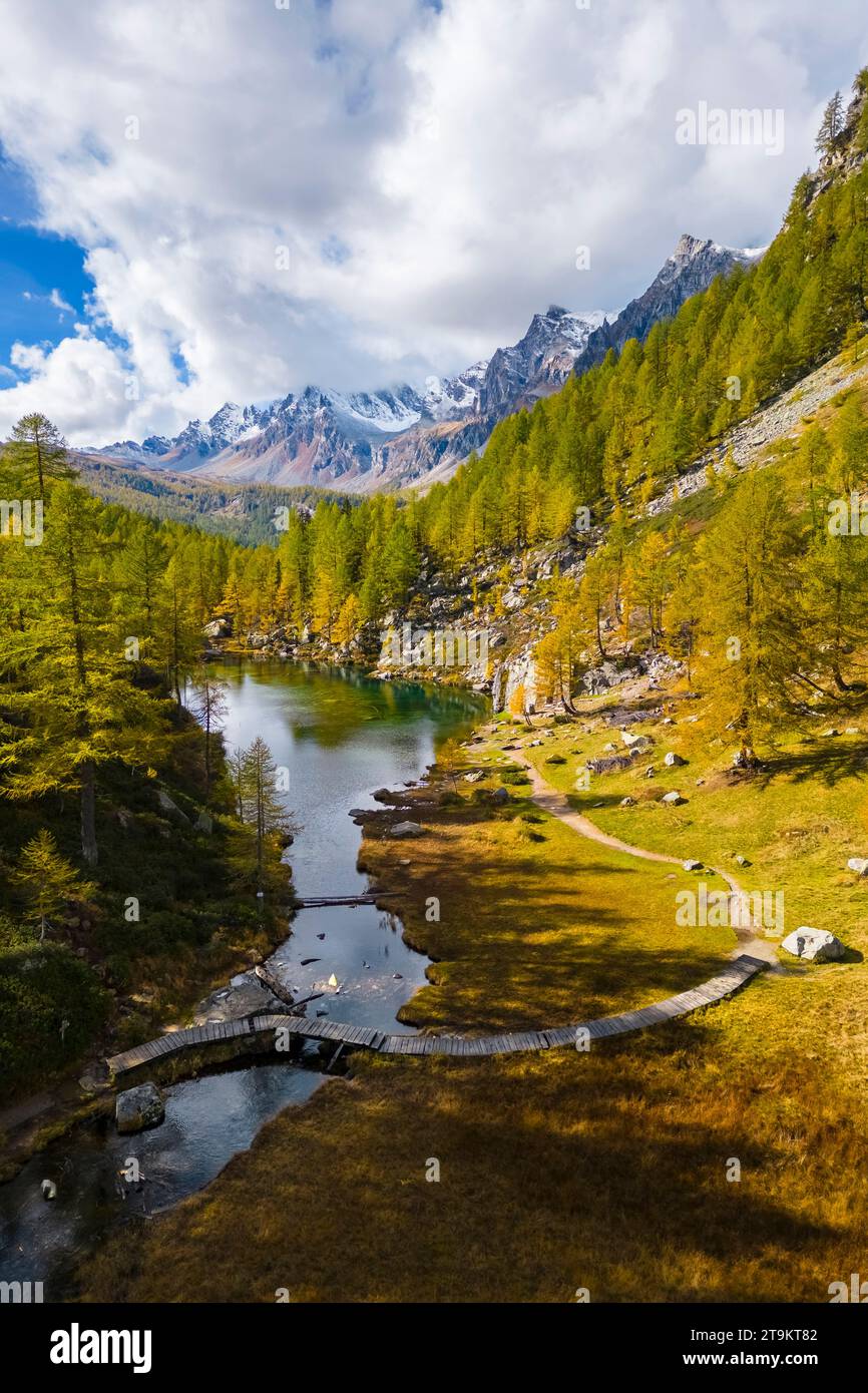 Autumnal view of the Lago delle Streghe lake at Crampiolo, Alpe Devero ...