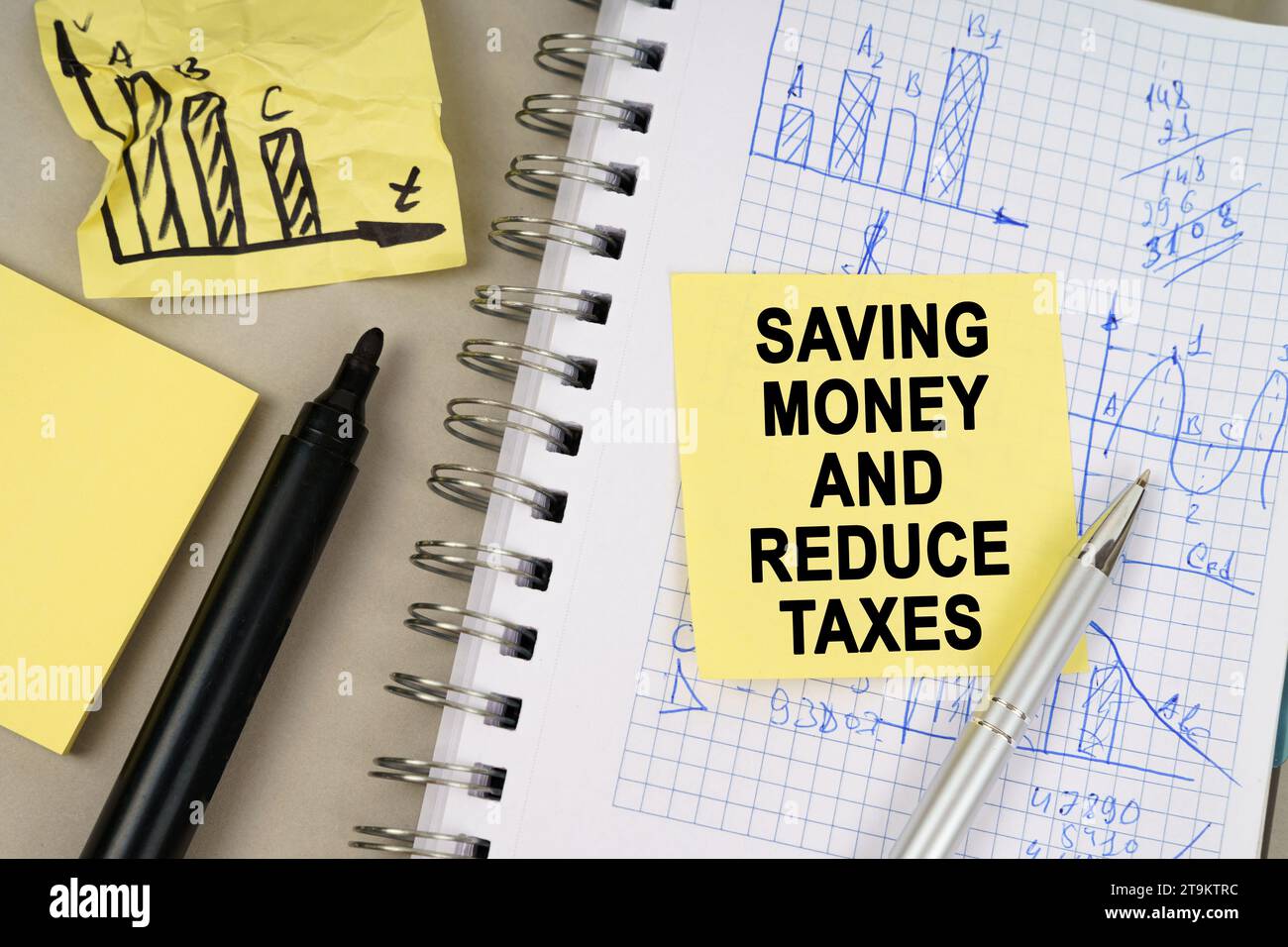 Business concept. On the table there is a notepad with notes and sticky ...