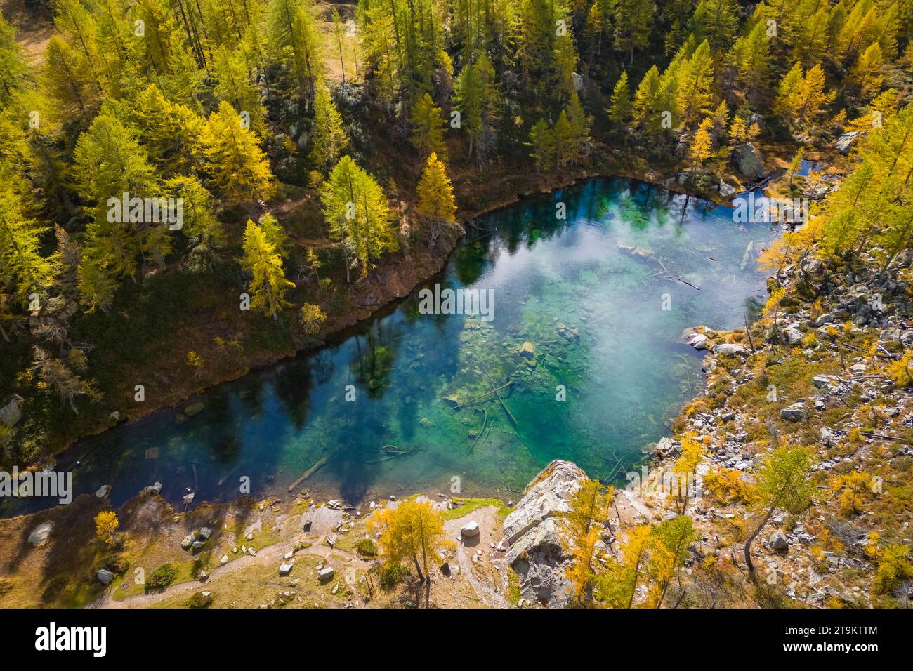 Autumnal view of the Lago delle Streghe lake at Crampiolo, Alpe Devero ...