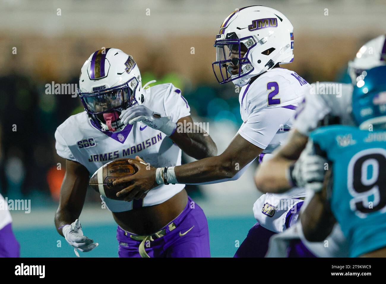James Madison quarterback Jordan McCloud (2) hands off to running back ...