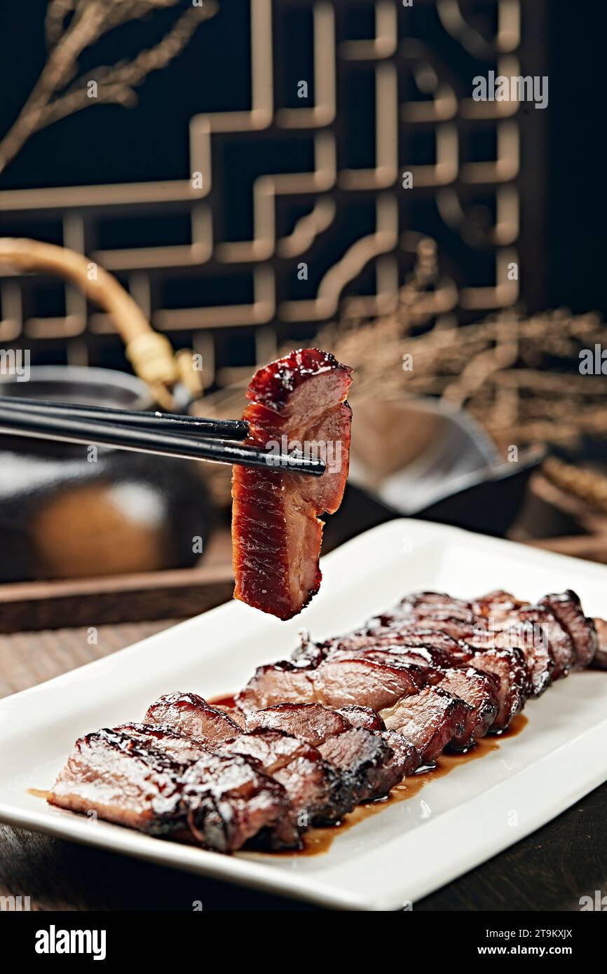 Char Siu - Honey barbecue roast pork on wood tray of wood table ...