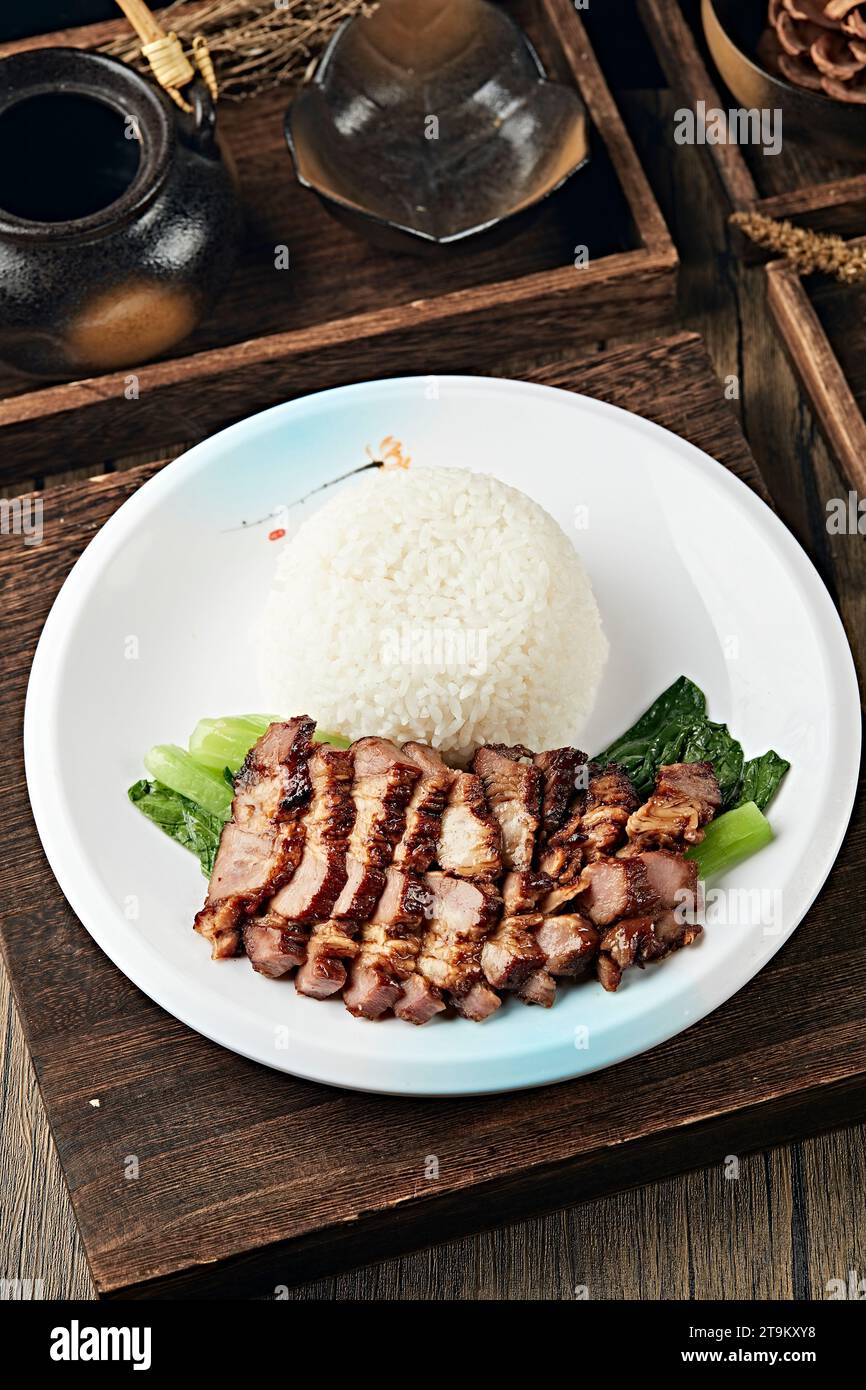 Char Siu - Honey barbecue roast pork on wood tray of wood table ...