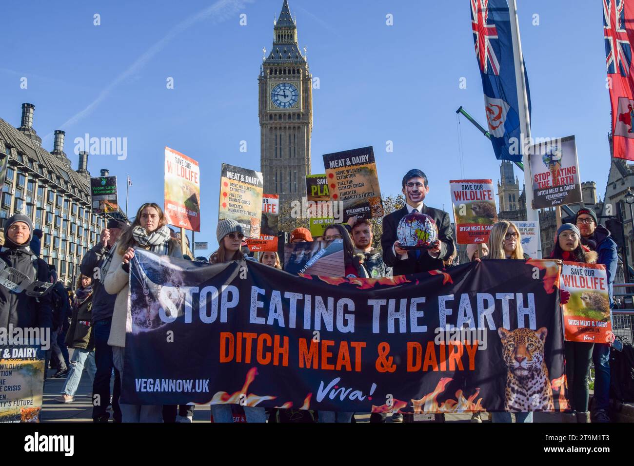 London, UK. 25th Nov, 2023. Protesters hold a "Stop eating the Earth ...