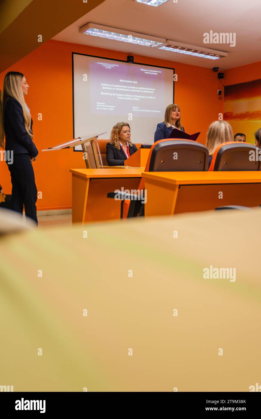 Professor giving a speech at the conference hall Stock Photo - Alamy