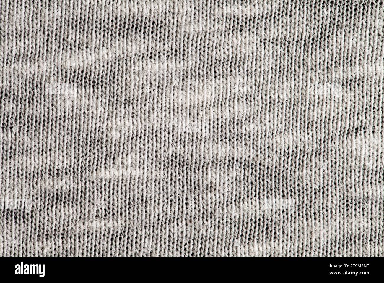 Knitted wool fabric, white threads, background structure, close-up ...