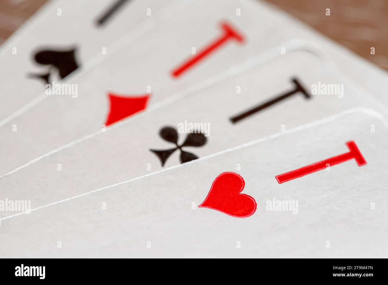 Playing cards, aces of hearts, clubs, diamonds, spades, macro close-up ...