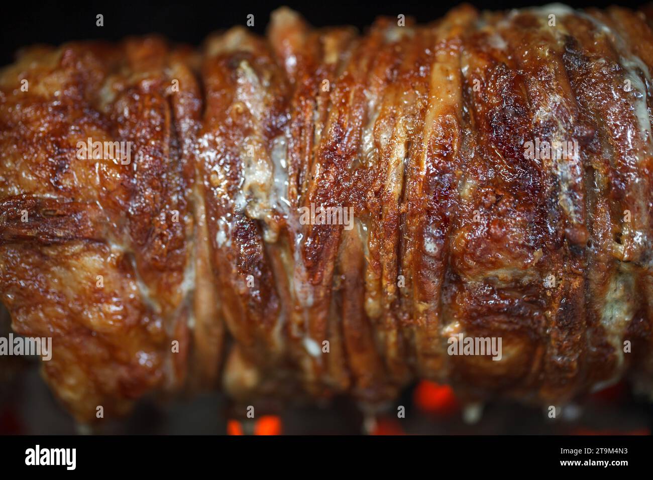 Lamb intestines with giblets spun on spit and fried to cook Turkish ...