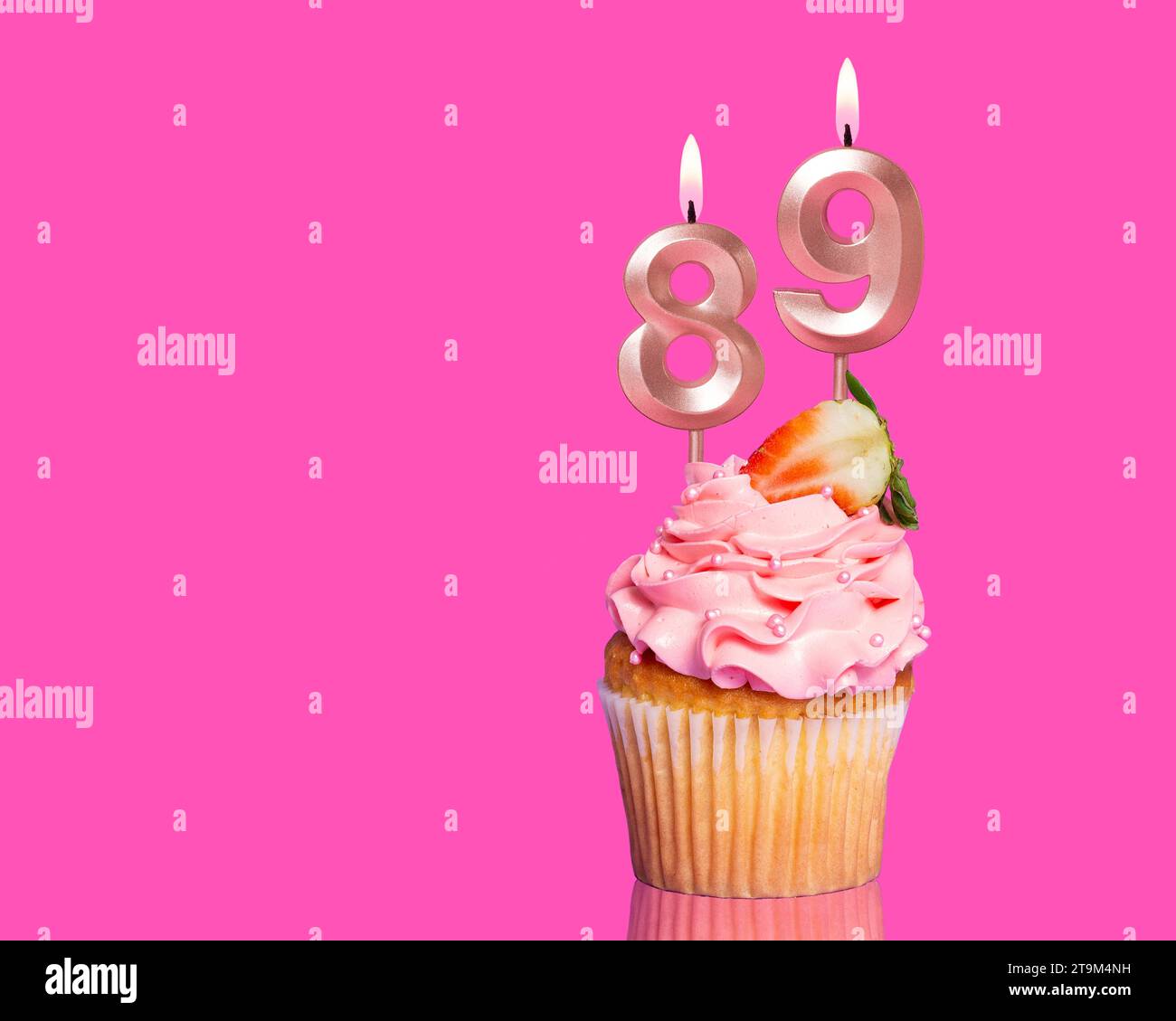 Birthday Cupcake With Candle Number 89 - On Hot Pink Background Stock ...