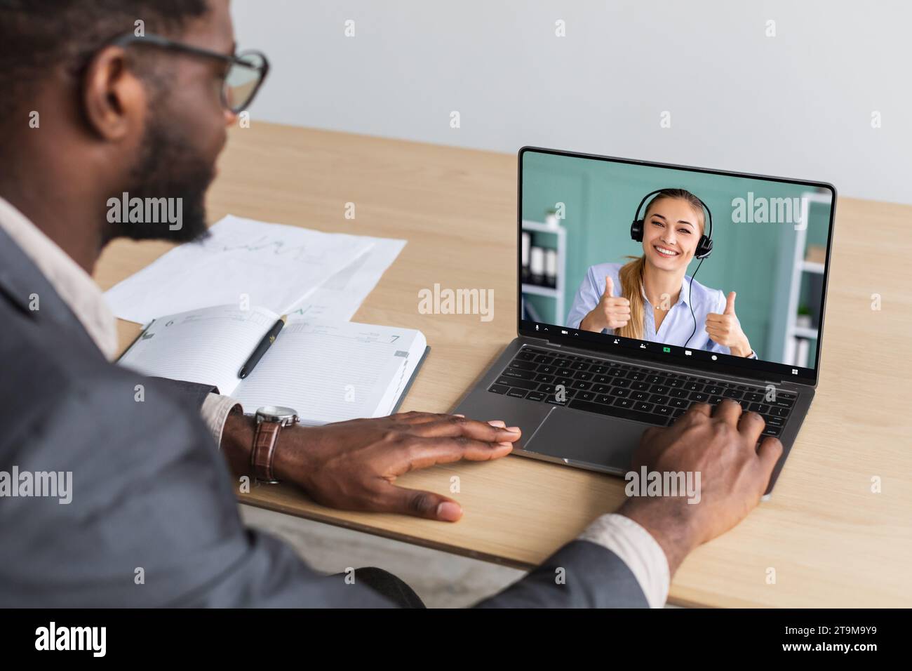 Millennial black entrepreneur working on laptop pc have video call ...
