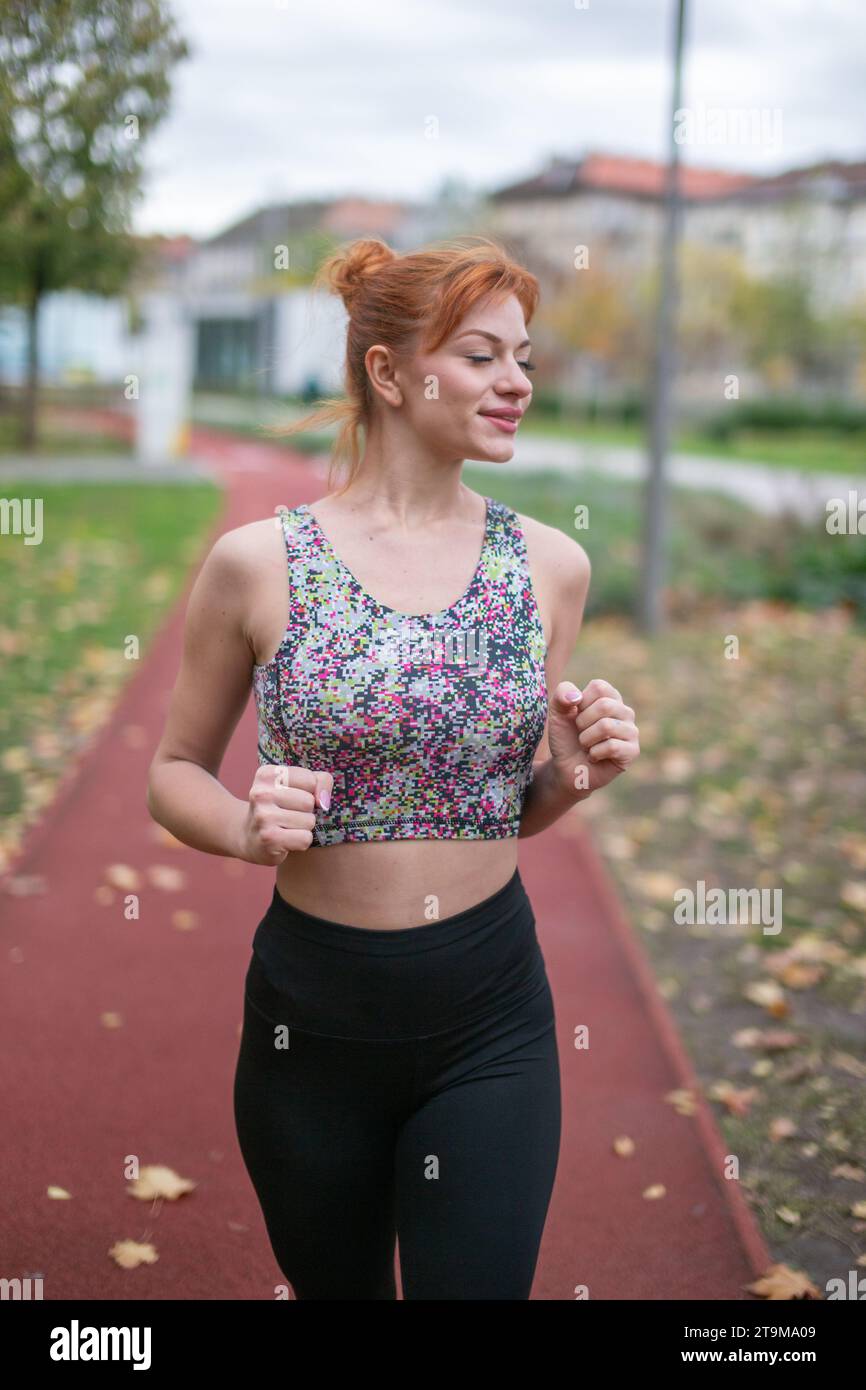 Female runner public park hi-res stock photography and images - Alamy