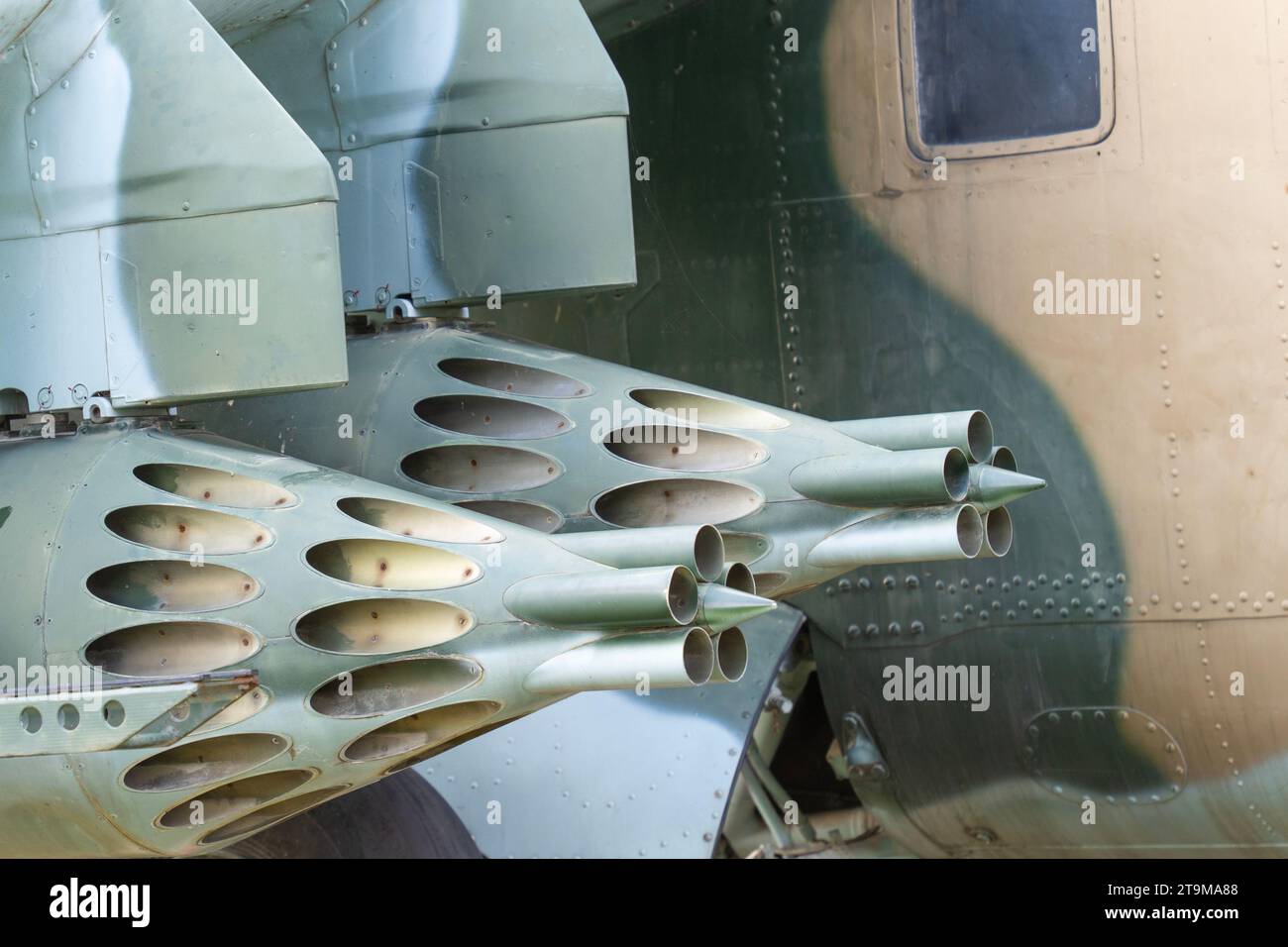 Old Soviet-made camouflage Mi-24 military helicopter rocket pods Stock ...