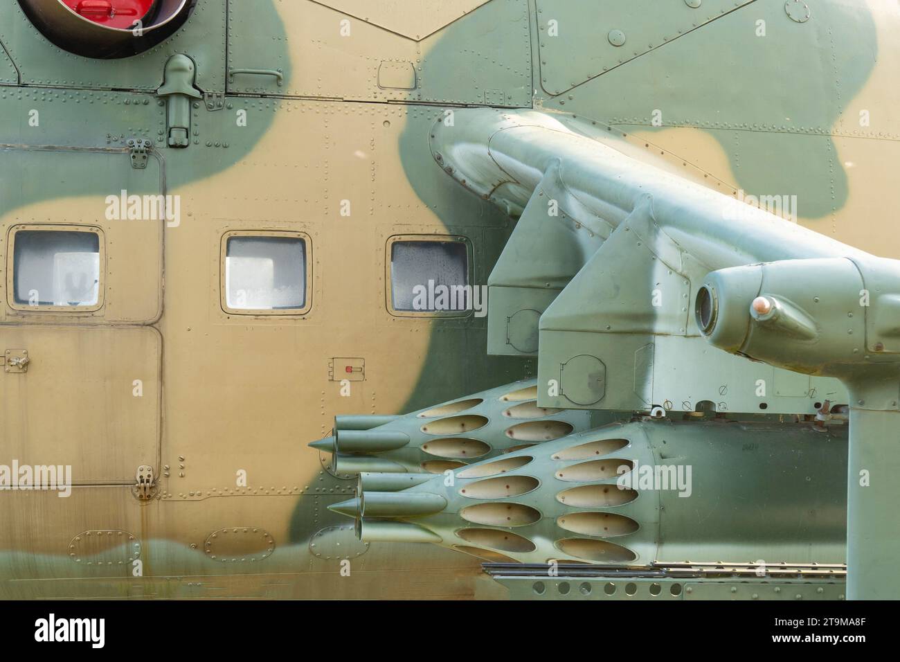 Old Soviet-made camouflage Mi-24 military helicopter rocket pods Stock ...