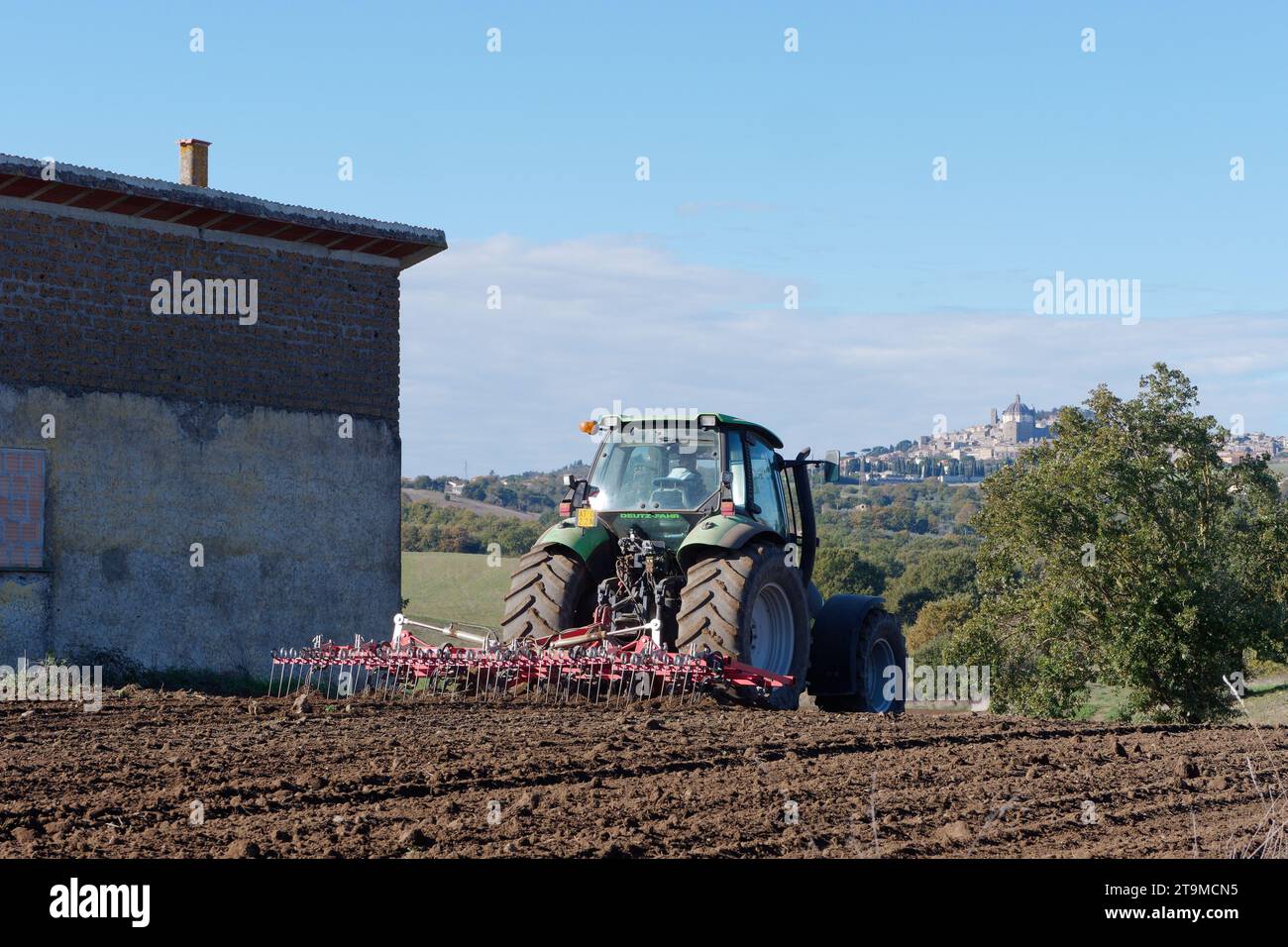 Tractor on a ploughed field on an autumn morning, Montefiascone and its ...