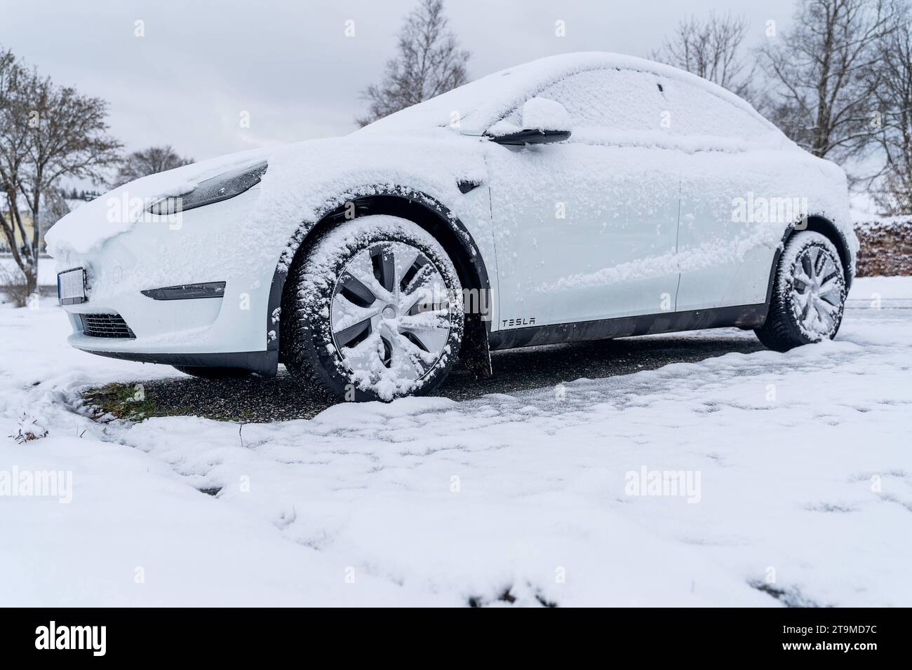 Bavaria, Germany - November 26, 2023: A snow-covered electric car of ...