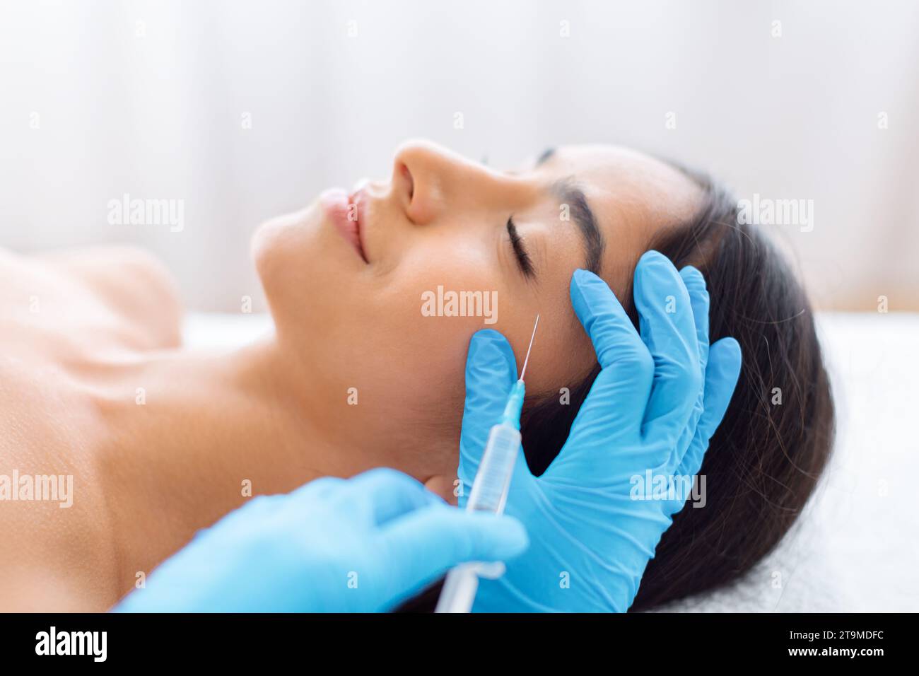 Beautiful young indian woman get intraocular beauty injection Stock ...