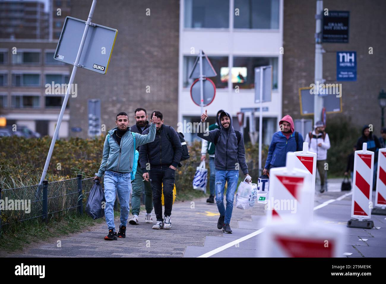 THE HAGUE - Asylum seekers arrive at the NH Hotel in Kijkduin from the ...