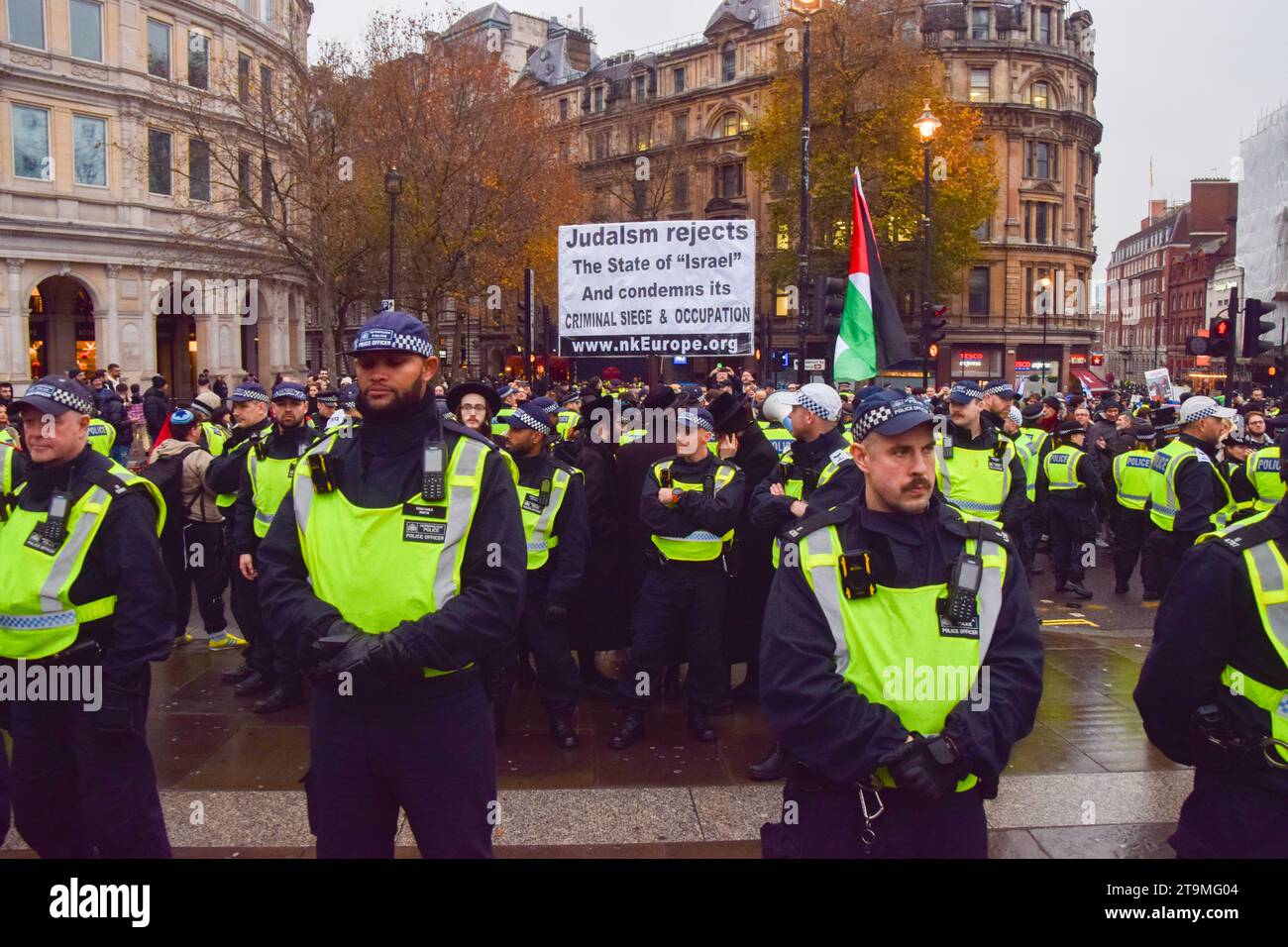 London, UK. 26th November 2023. Police officers intervene as anti ...