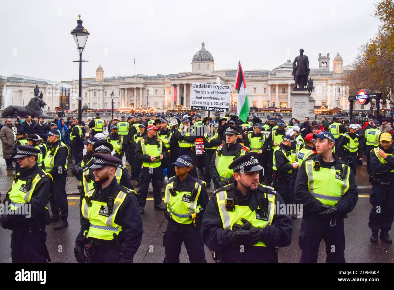 London, UK. 26th November 2023. Police officers intervene as anti ...