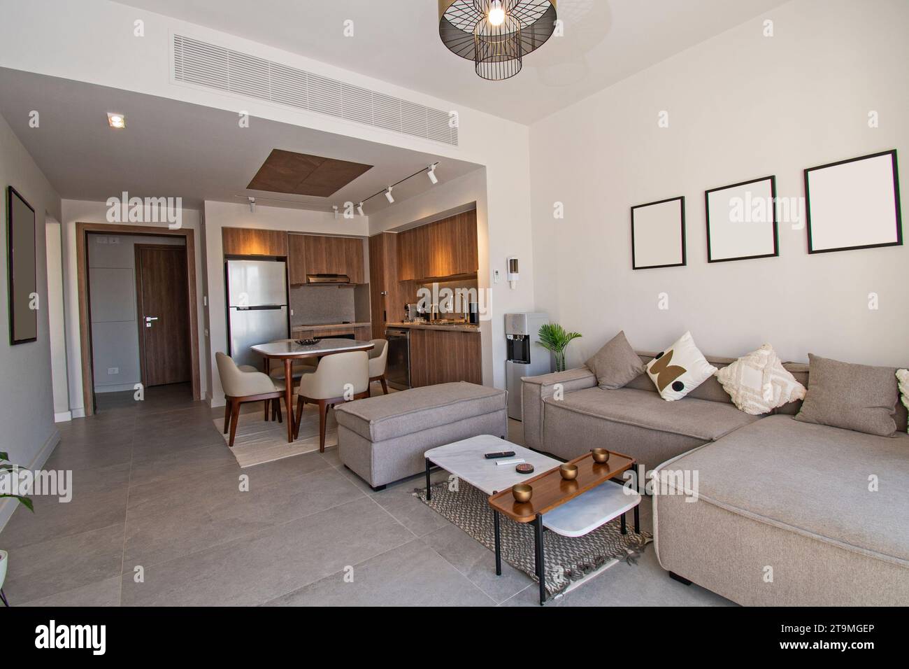 Living room lounge area in luxury tropical holiday apartment show home ...