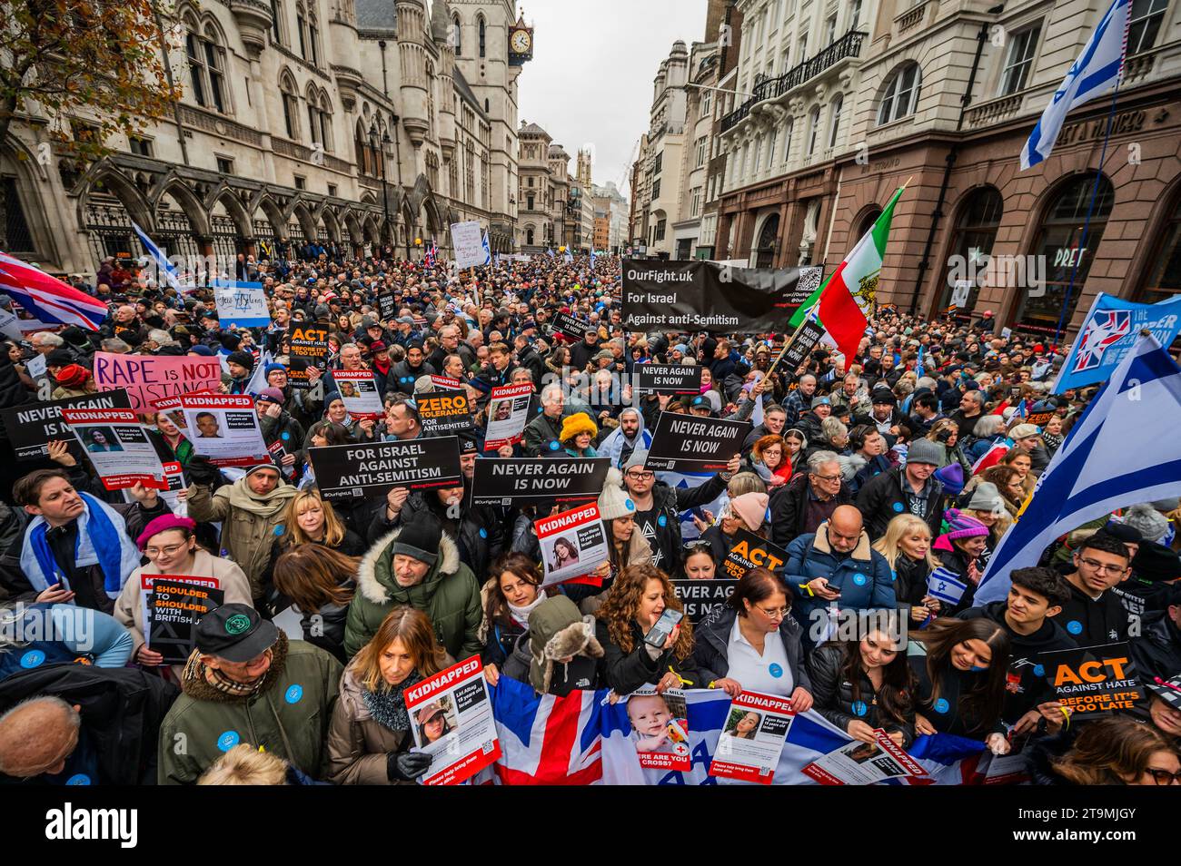 London, UK. 26th Nov, 2023. The march gathers outside the Royal Courts ...
