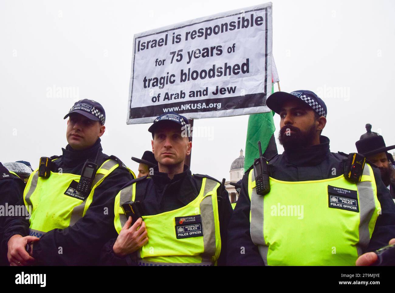 London, England, UK. 26th Nov, 2023. Police officers intervene as anti ...