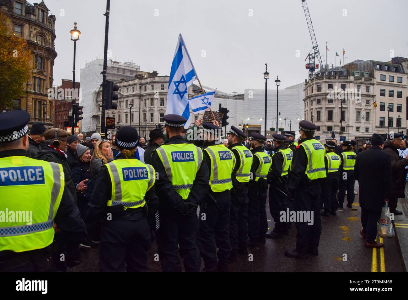London, England, UK. 26th Nov, 2023. Police officers intervene as anti ...