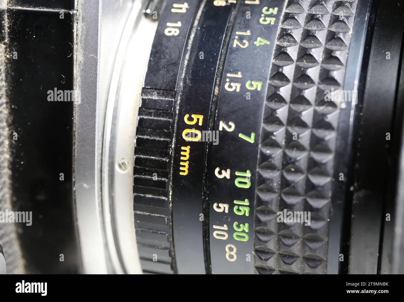 Closeup of old scratched black 50 mm lens with aperture and focal ...