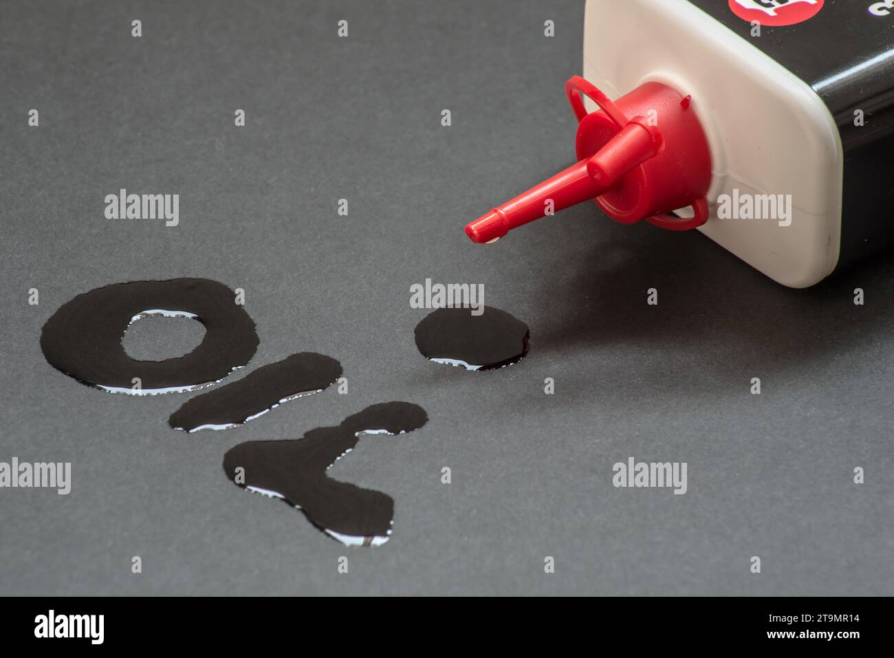 The word 'Oil' spelt out in oil which appears to have spilled from an ...